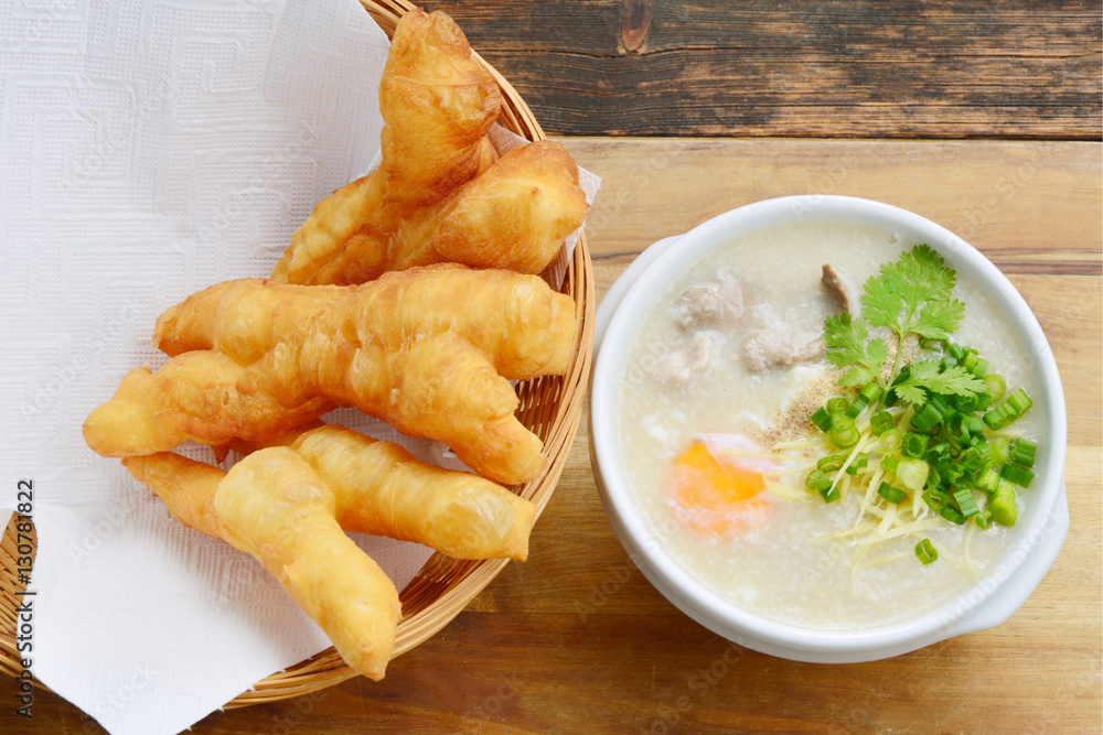 Pork congee with deep-fried dough stick. Rice porridge with liver ...
