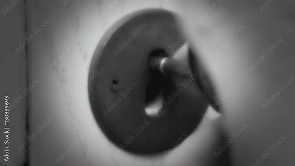 Inserting and removing a key into a lock, locking and unlocking a door ...