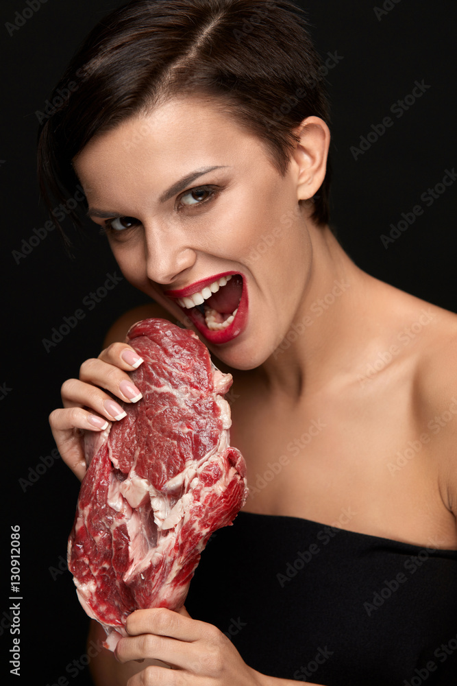 Eating Meat. Beautiful Woman Biting Raw Red Beef Steak Meat Stock-Foto ...