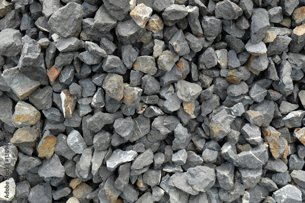 aggregate - a stack of gravel / grit consisting of larger dark and ...