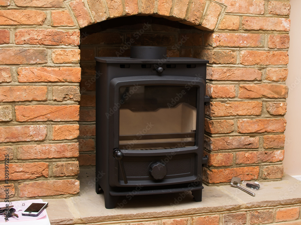 Logburner installation in process: fitting the woodburner into the ...