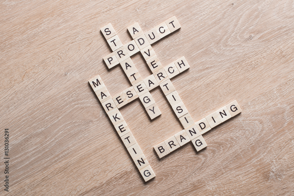 Conceptual business keywords on table with elements of game making ...