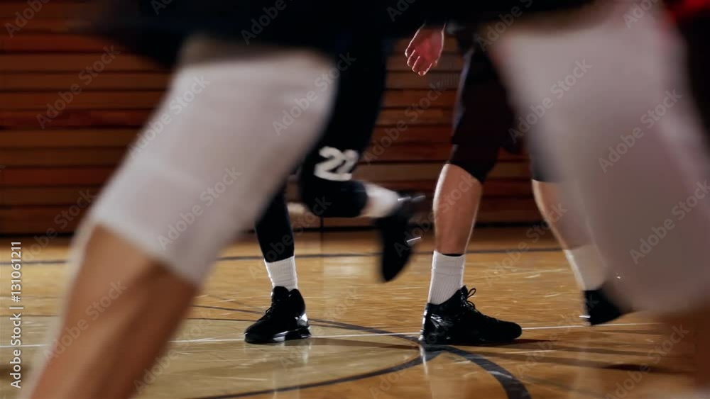 Low angle of basketball players running down a court Stock-Video ...