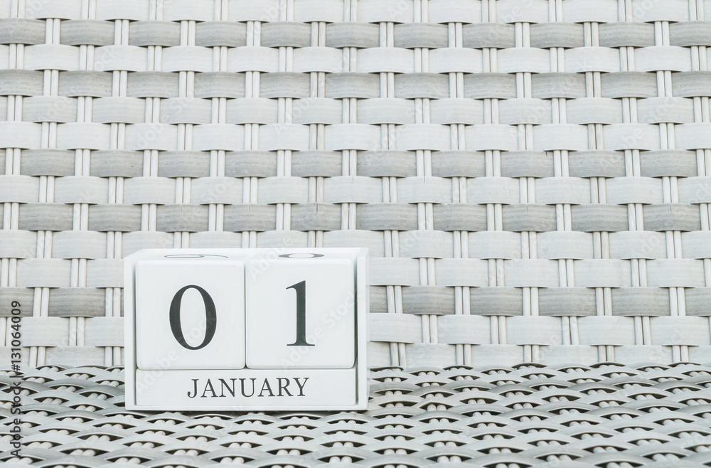 Closeup surface white wooden calendar with black 1 january word on ...