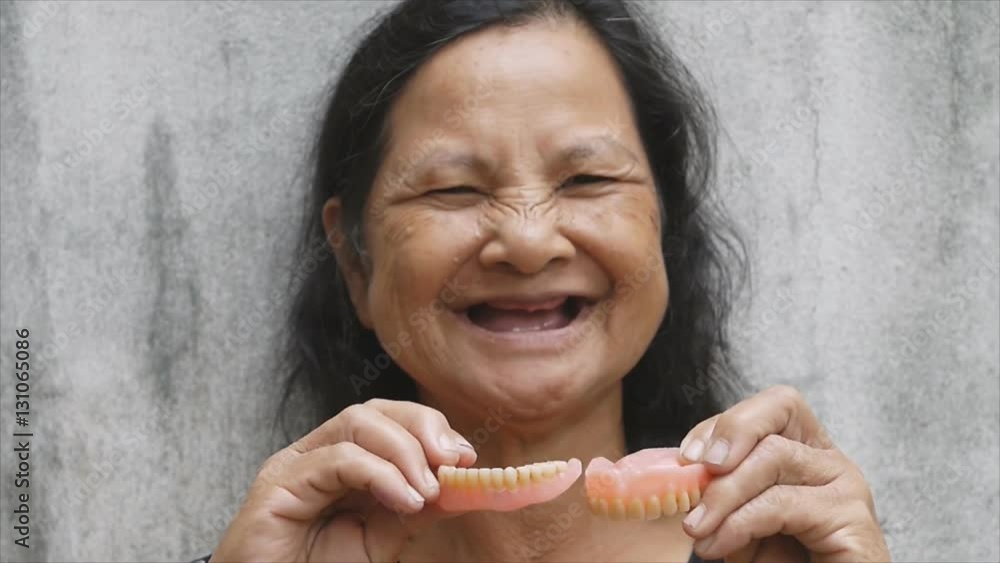 Close up old Thai woman portrait wearing false teeth Stock Video ...
