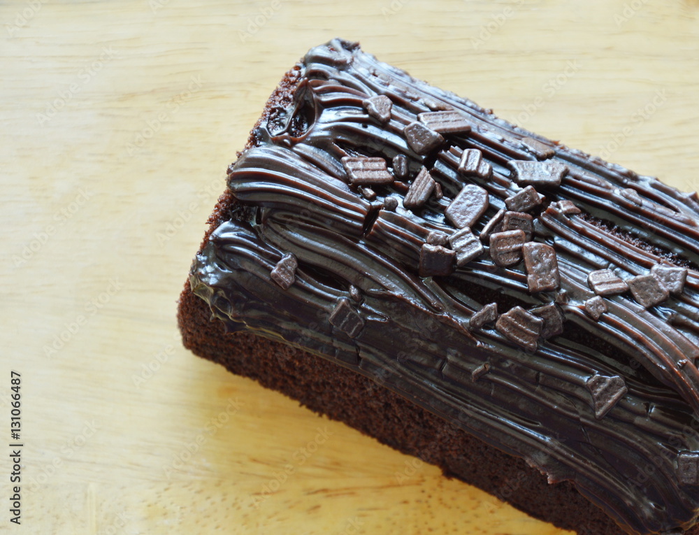 dark chocolate cake jam stuffed cream on wooden chopping block Stock ...