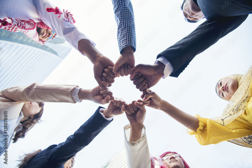 Multiethnic group of young collaboration team standing hands together ...