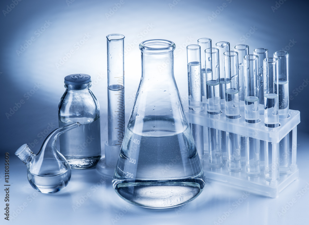 Different laboratory beakers and glassware. Stock Photo | Adobe Stock