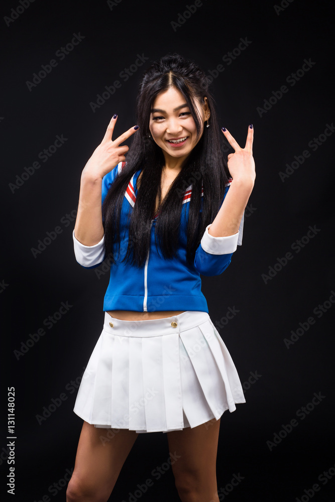 Brunette Asian woman with red lips showing yo signs while expressing ...