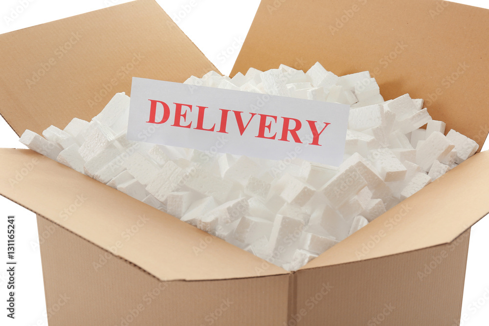 Delivery service concept. Cardboard box full of polystyrene, closeup ...