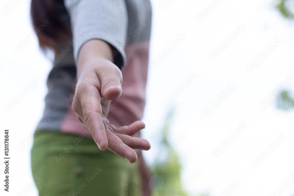 Help concept woman hand reaching to pick up someone Stock Photo | Adobe ...