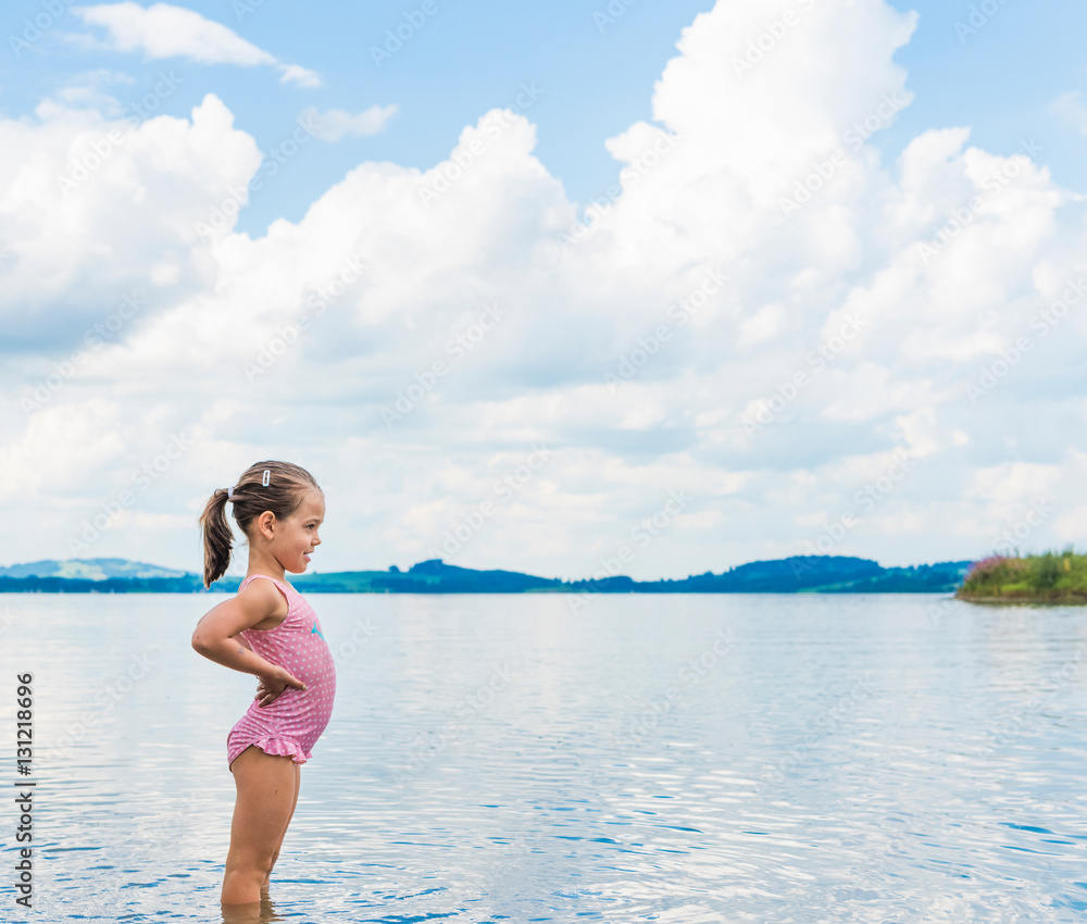 Girl Wearing Swim Suit By Lake Looking Away Fuessen Bavaria Germany