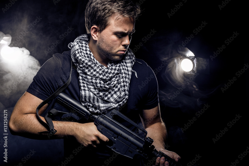 Soldier or mercenary wearing a shemagh with assault rifle, paintball or ...