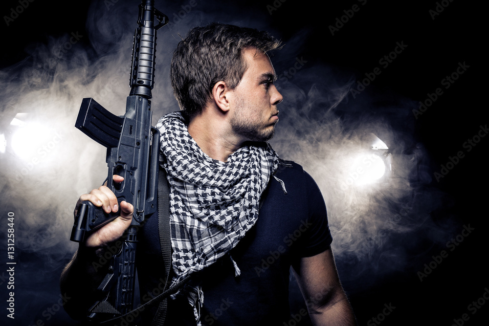 Soldier or mercenary wearing a shemagh with assault rifle, paintball or ...