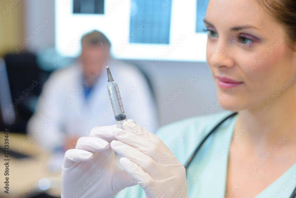 Closeup of nurse preparing syringe Stock Photo | Adobe Stock