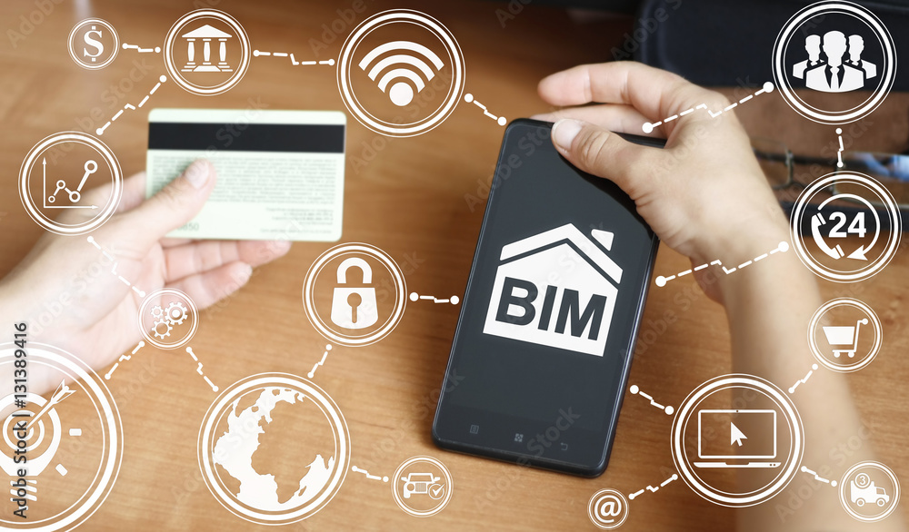Smart phone with bim icon. Hand holding smartphone with sign building ...