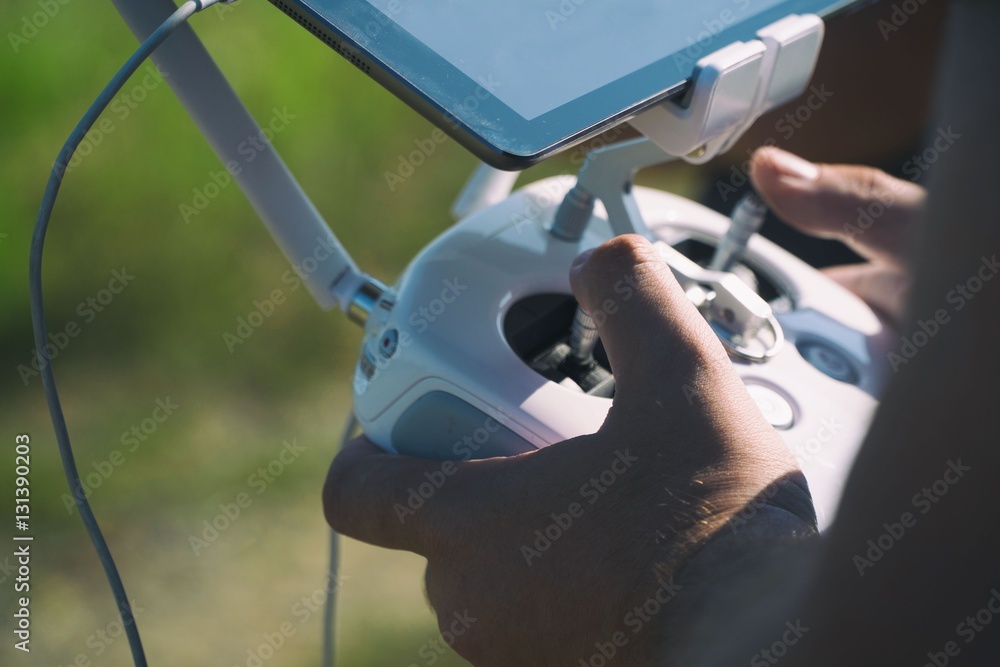 Drone remote control in hand man.Man operating of flying drone Stock ...