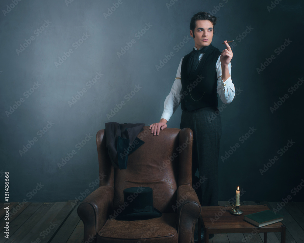 Vintage victorian man standing next to chair smoking cigarette. Stock ...