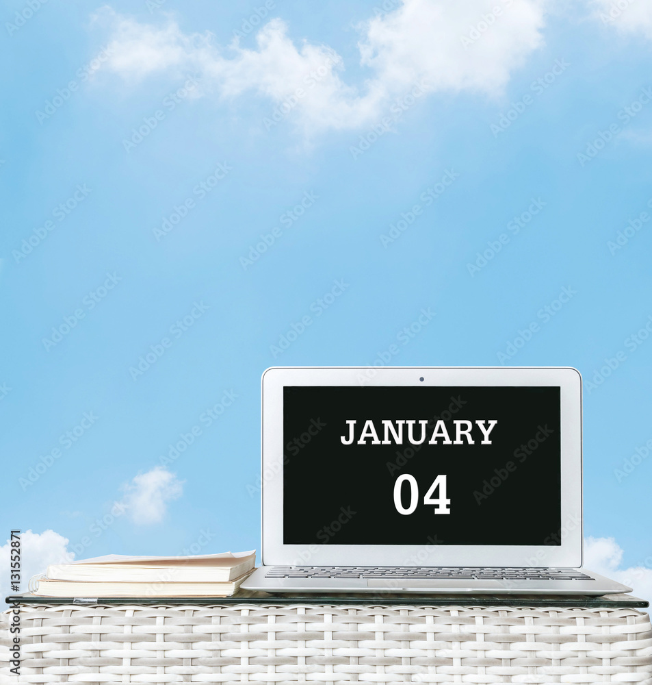 Closeup computer laptop with january 4 word on the center of screen in ...