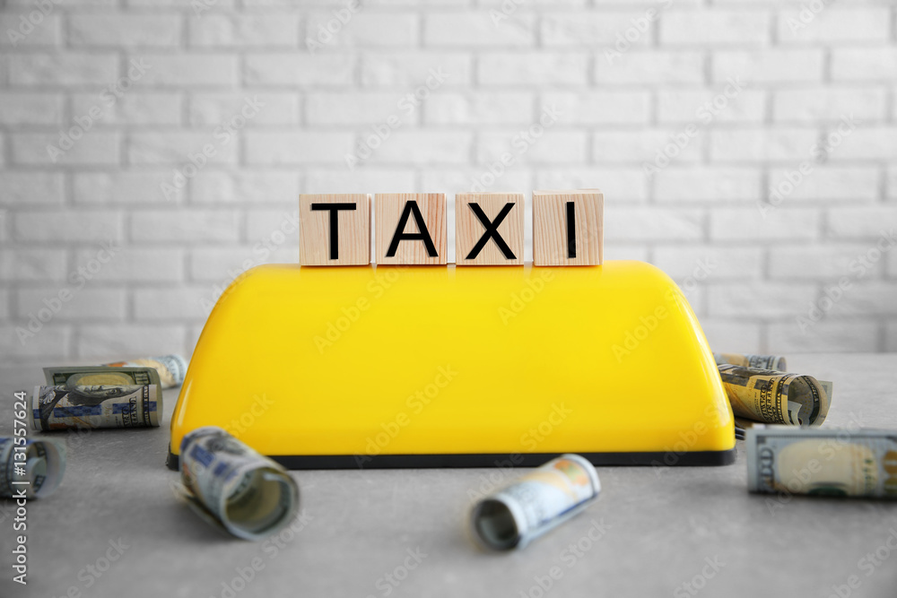 Cubes with word taxi and roof sign on brick wall background Stock Photo ...