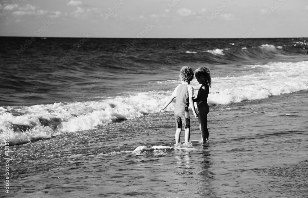 kids playing on the beach at sunset Stock Photo | Adobe Stock