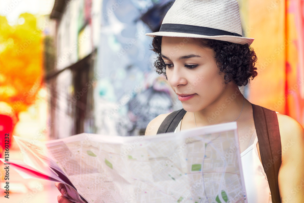 Girl holding map in the city Stock Photo | Adobe Stock