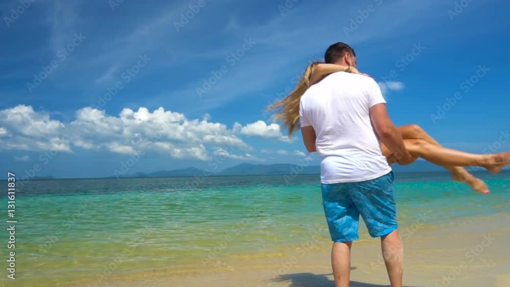 Romantic Couple Spinning and Embracing in Water, Laughing and Splashing ...