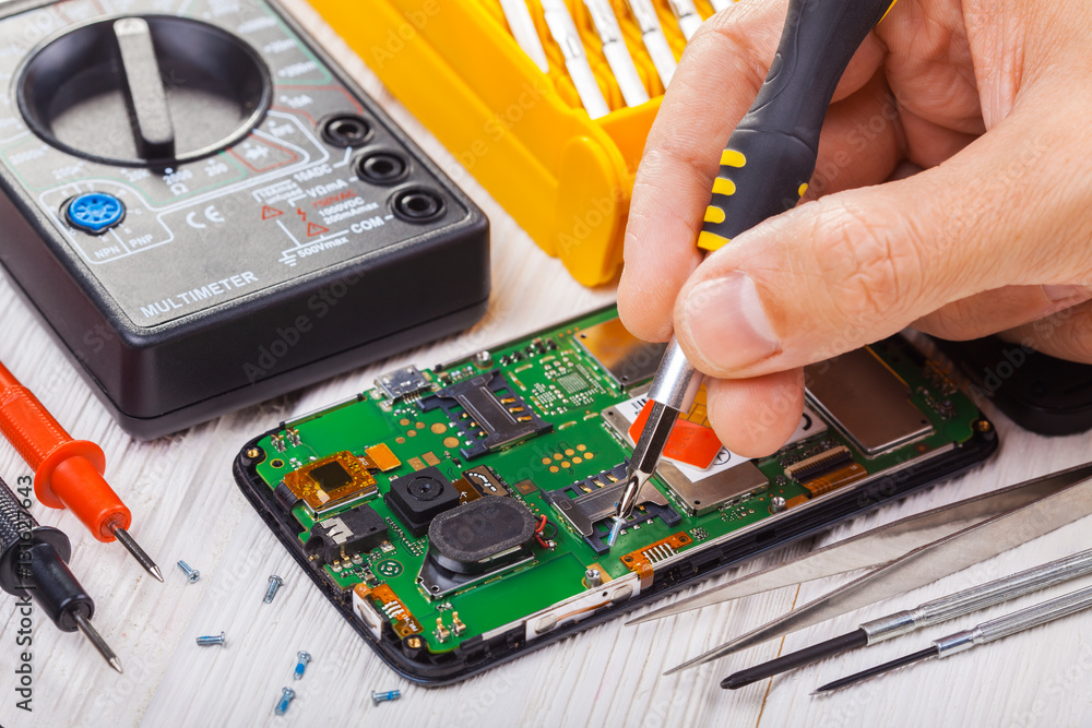 repair and testing smartphone with a multimeter Stock Photo | Adobe Stock