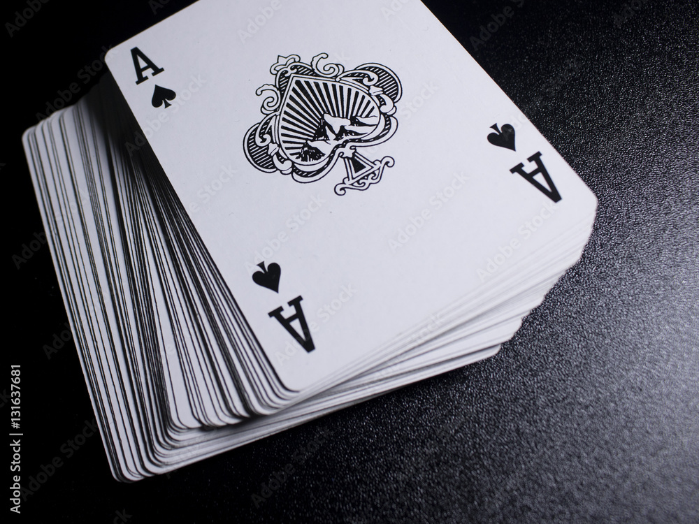 poker card stack deck on dark black background Stock Photo | Adobe Stock