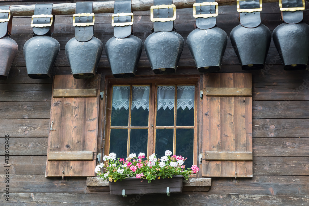Old window with open shutters decorated with flowers and bells Stock ...
