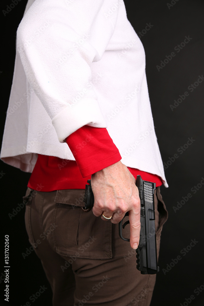 Armed woman with semi-automatic in home invasion scenario Stock Photo ...