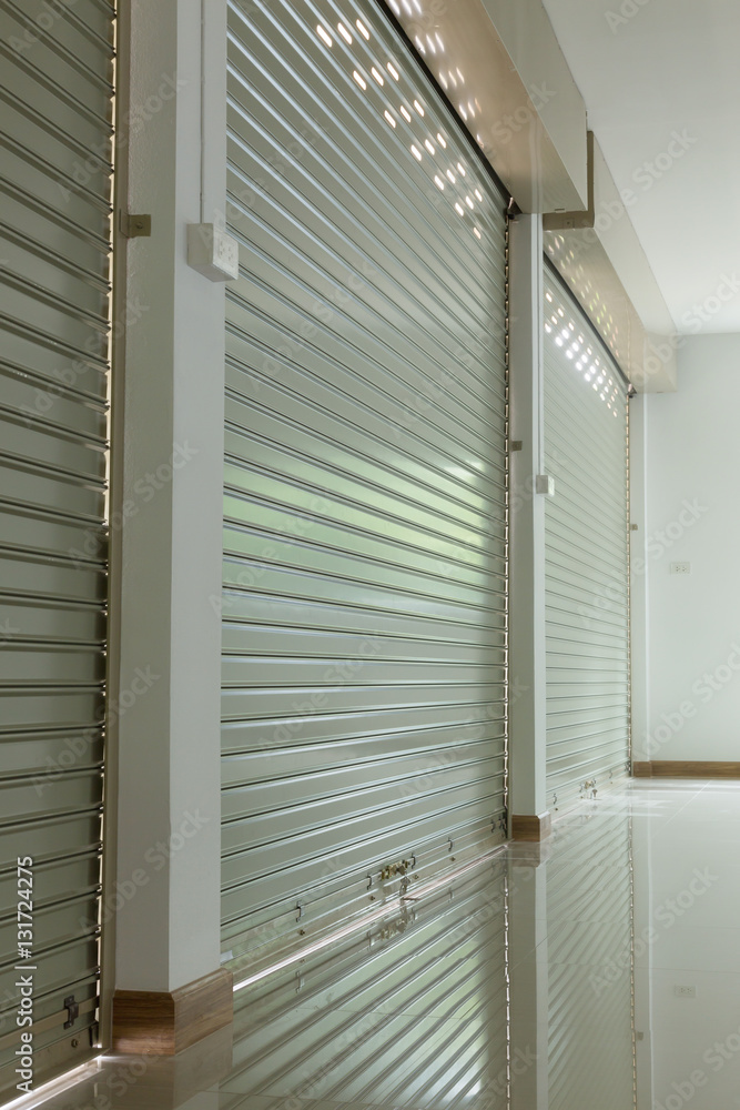 roller shutter door in warehouse building Stock Photo | Adobe Stock