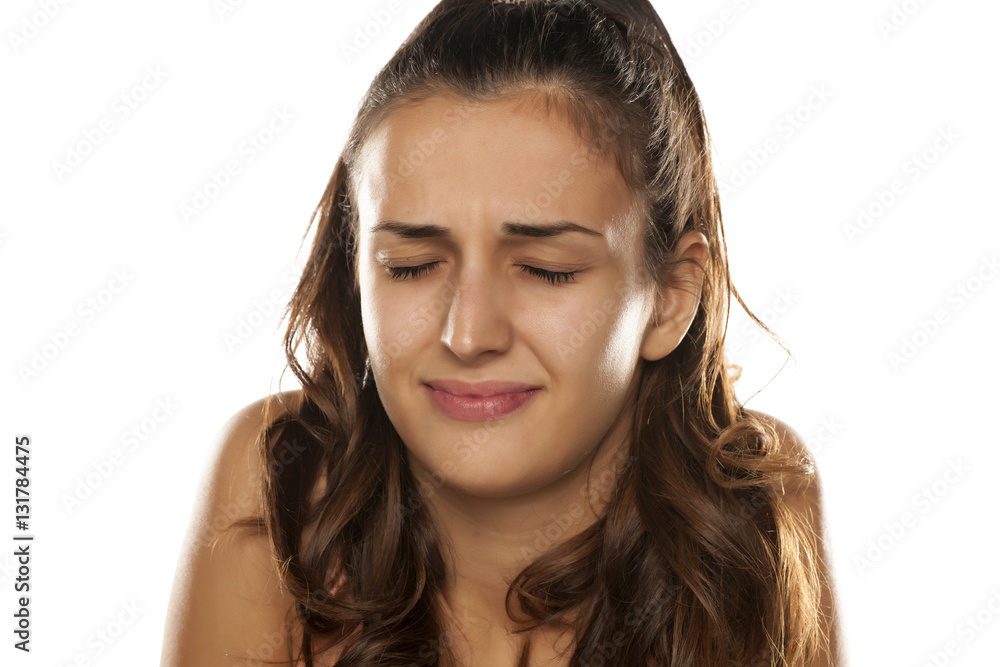 young woman with a pained expression on her face Stock Photo | Adobe Stock