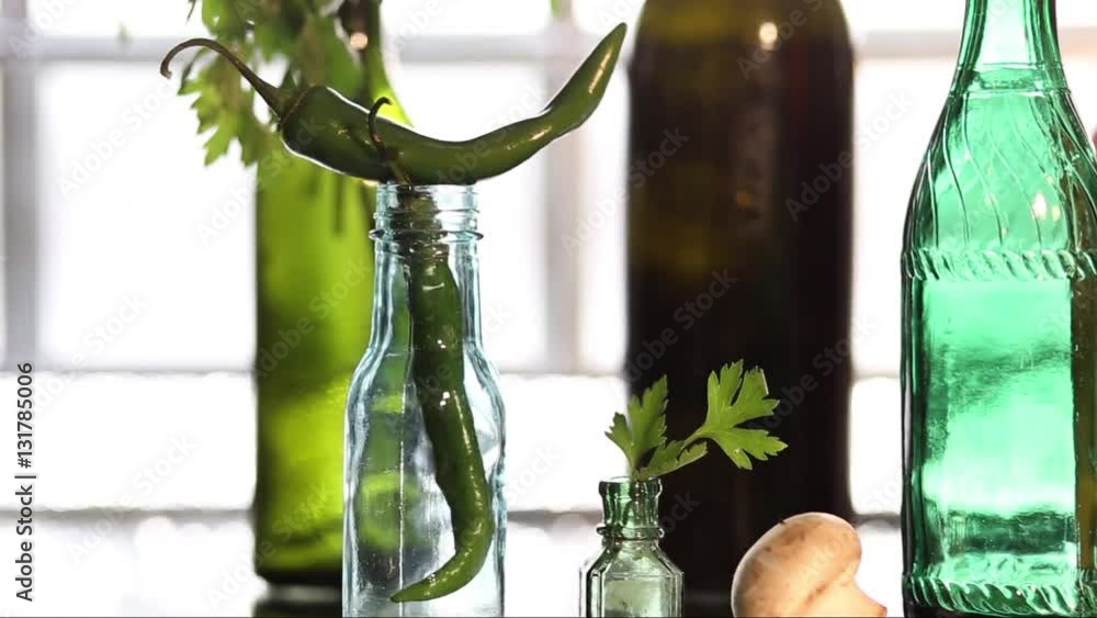 Close-up of green chili peppers in a bottle Stock Video | Adobe Stock