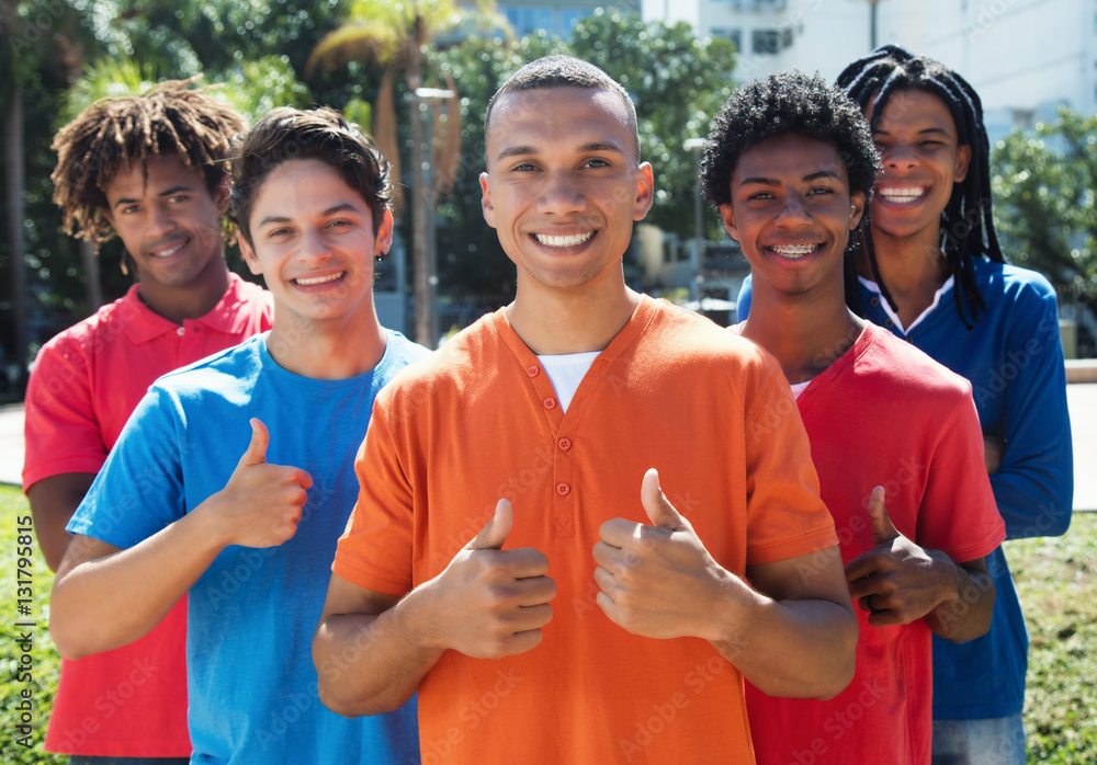 Group of five young men showing thumbs up Stock-Foto | Adobe Stock