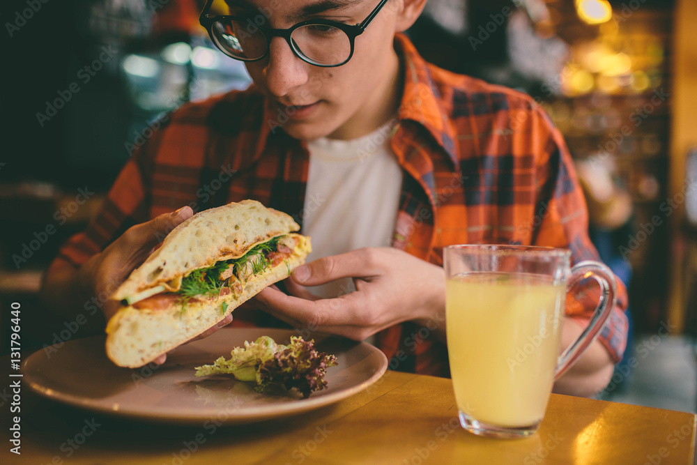 Man eating in a restaurant and enjoying delicious food Stock Photo ...