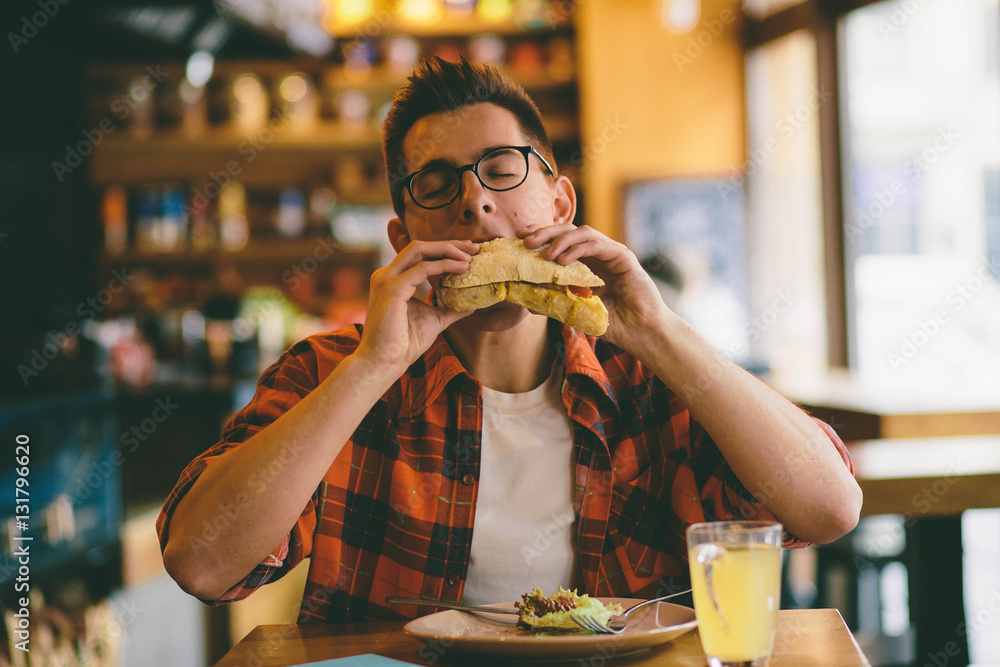 Man eating in a restaurant and enjoying delicious food Stock Photo ...