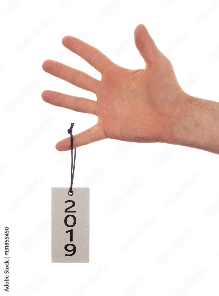 Hand holding a tag - New year - 2019 Stock Photo | Adobe Stock