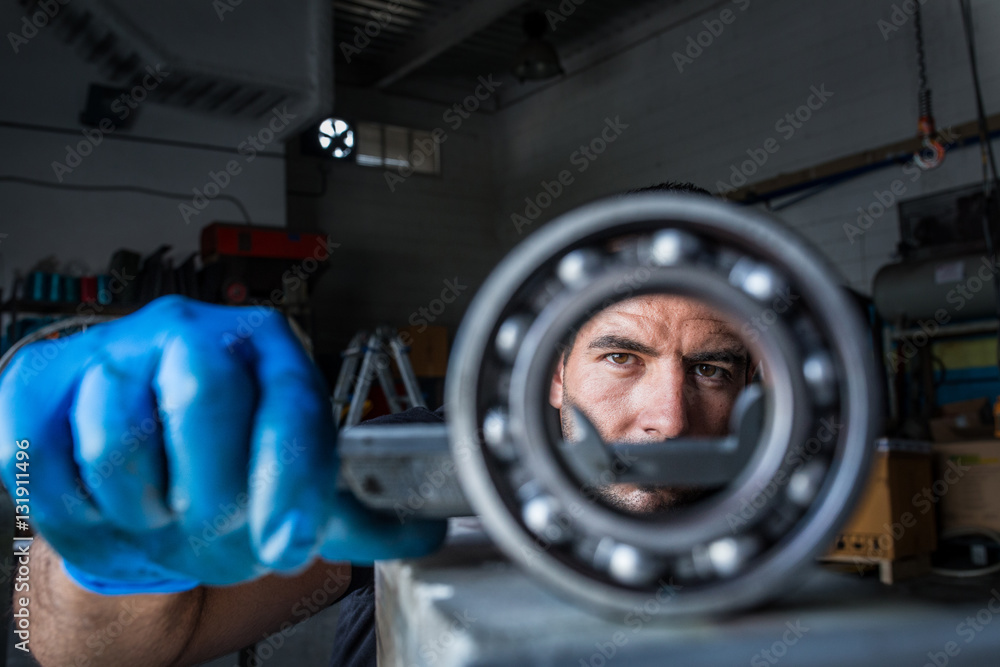 Mechanic fixing a compressor engine Stock Photo | Adobe Stock