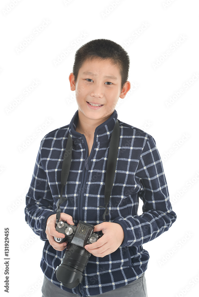 Asian boy holding camera on white background. Stock-Foto | Adobe Stock
