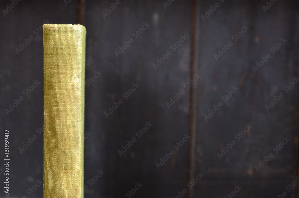 Green antique book spine on old wooden bookshelf background Stock Photo ...