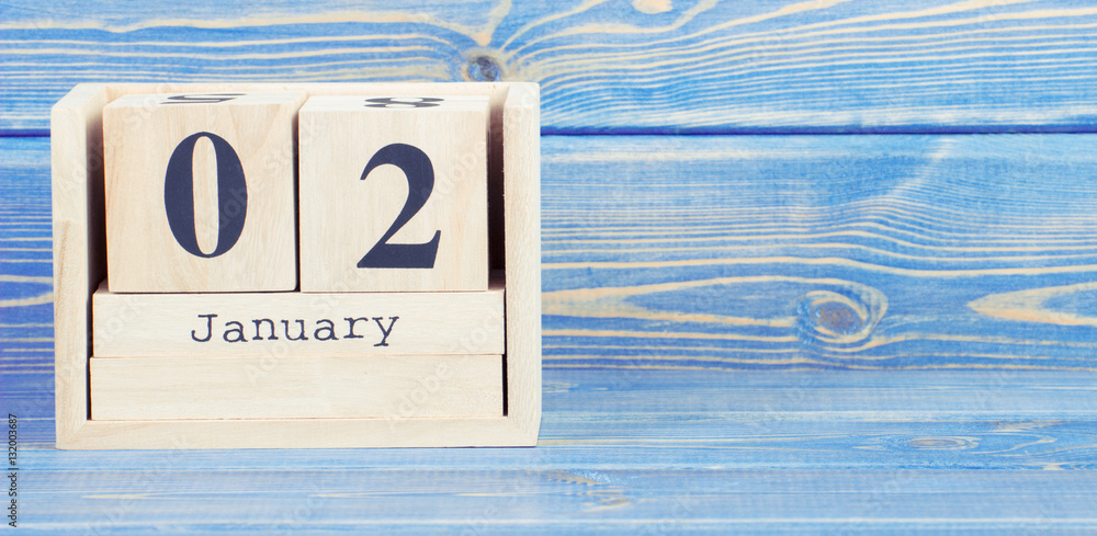 Vintage photo, January 2nd. Date of 2 January on wooden cube calendar ...
