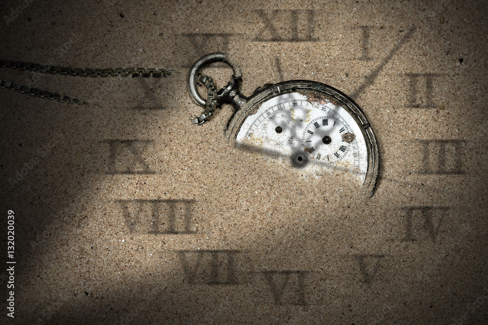 Broken pocket watch with shadows of clock hands and roman numbers ...
