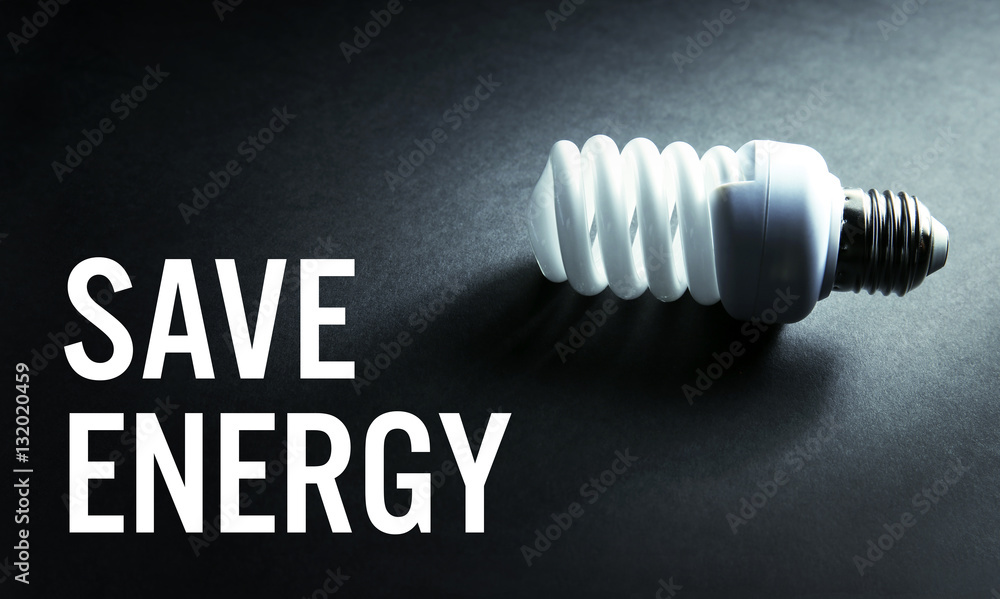 Light bulb and text SAVE ENERGY on dark background Stock Photo | Adobe ...