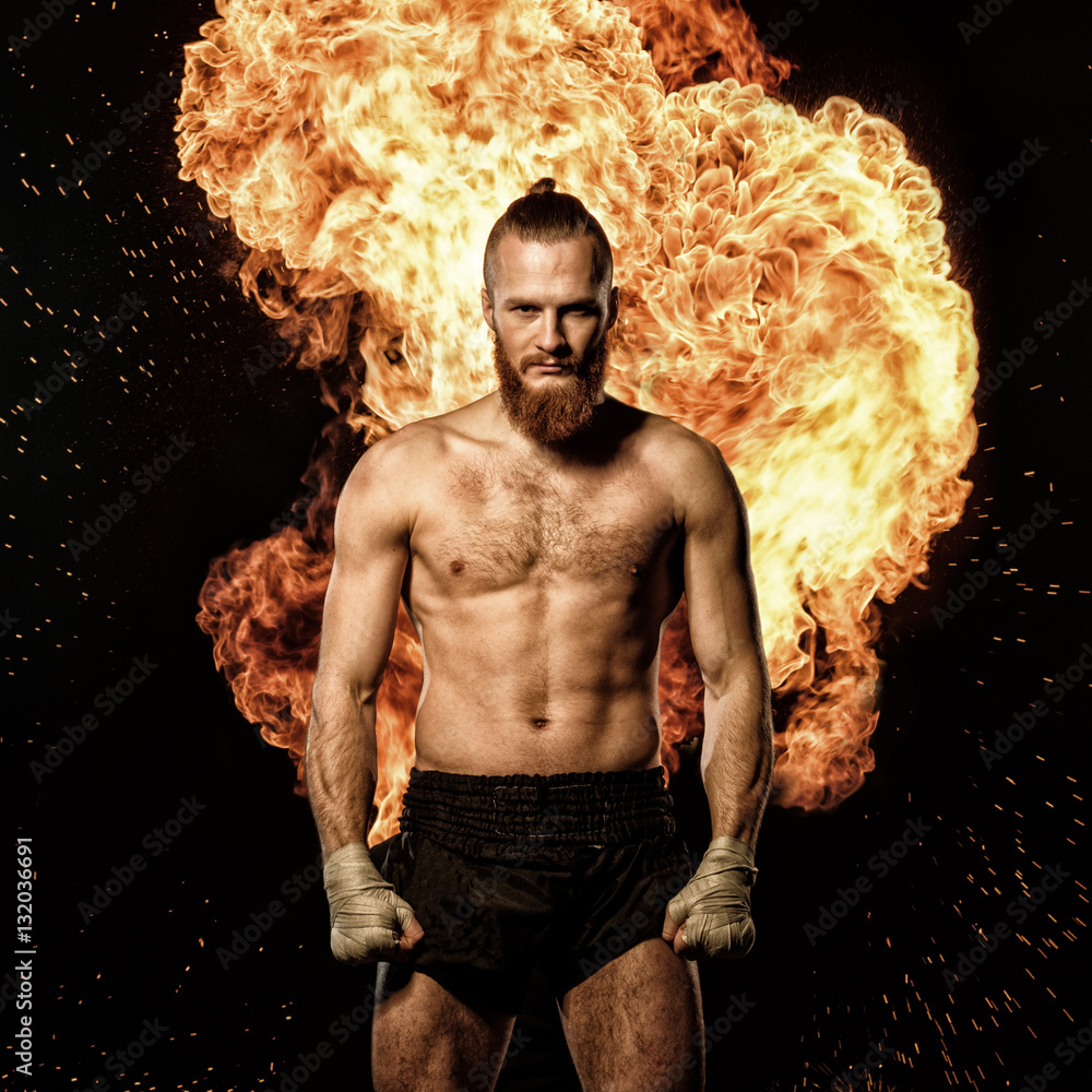 Professional fighter with fire on background Stock Photo | Adobe Stock