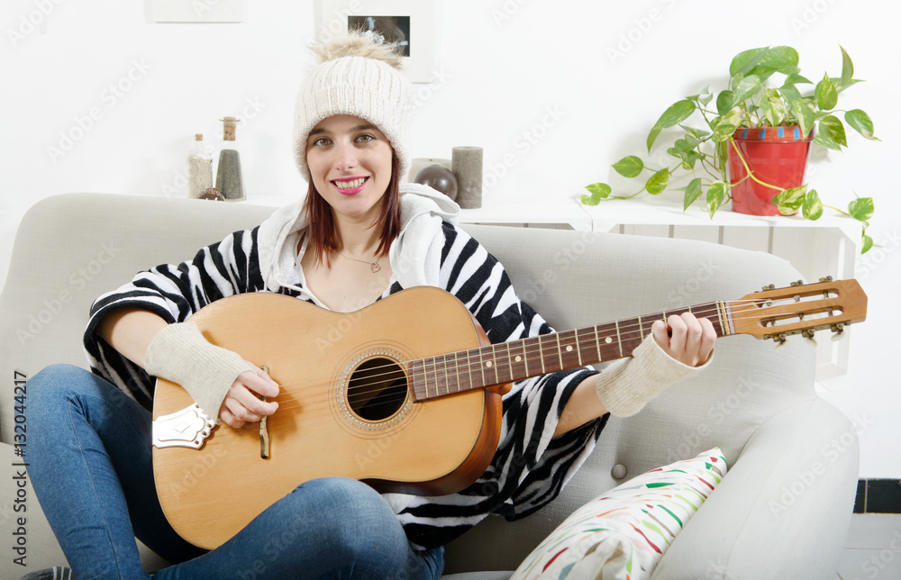 beautiful young woman playing the acoustic guitar Stock Photo | Adobe Stock
