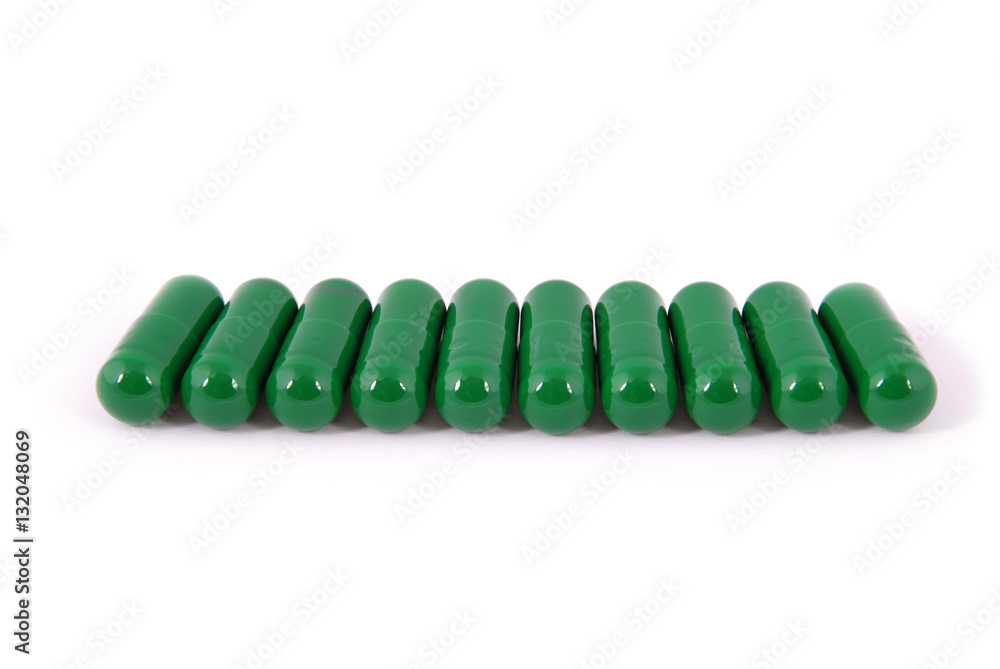 Group of capsule pills with green color Stock Photo | Adobe Stock