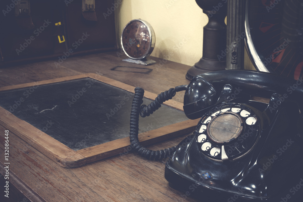 Black antique vintage analog telephone dialling or scrolling phone with ...