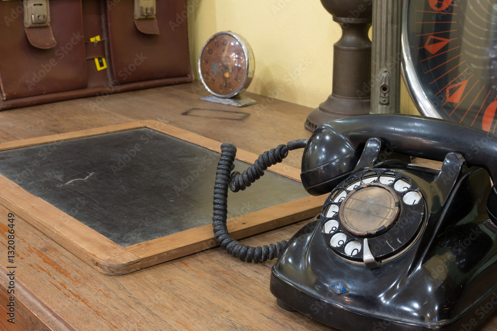 Black antique vintage analog telephone dialling or scrolling phone with ...