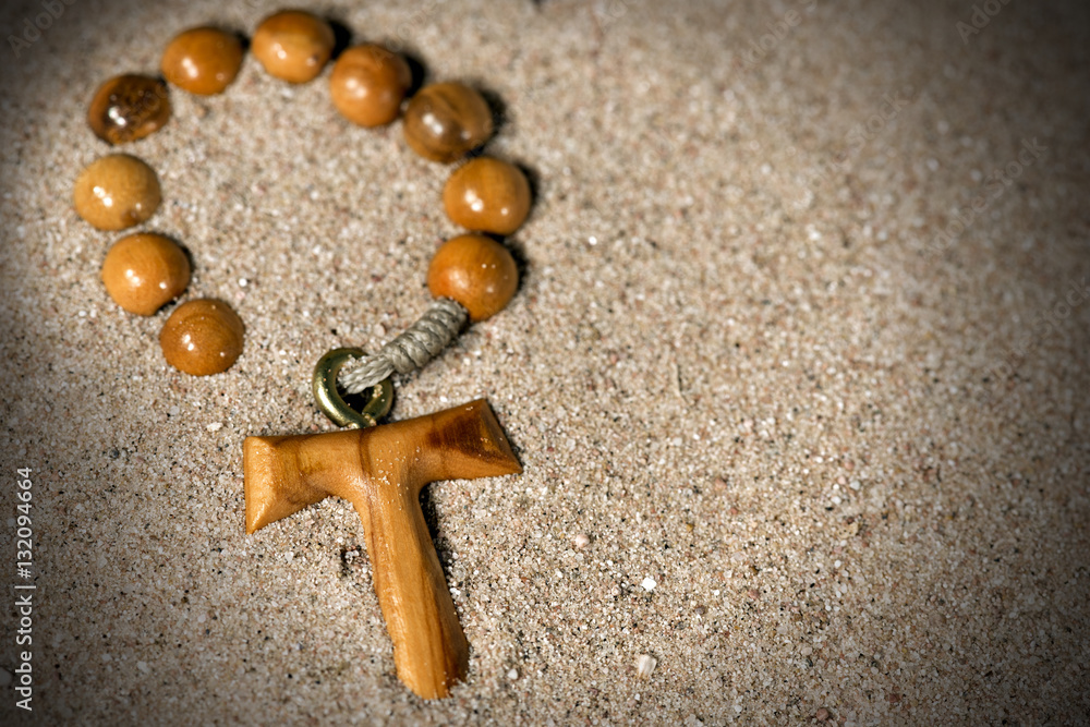 Tau, wooden cross symbol of St. Francis of Assisi with rosary bead ...